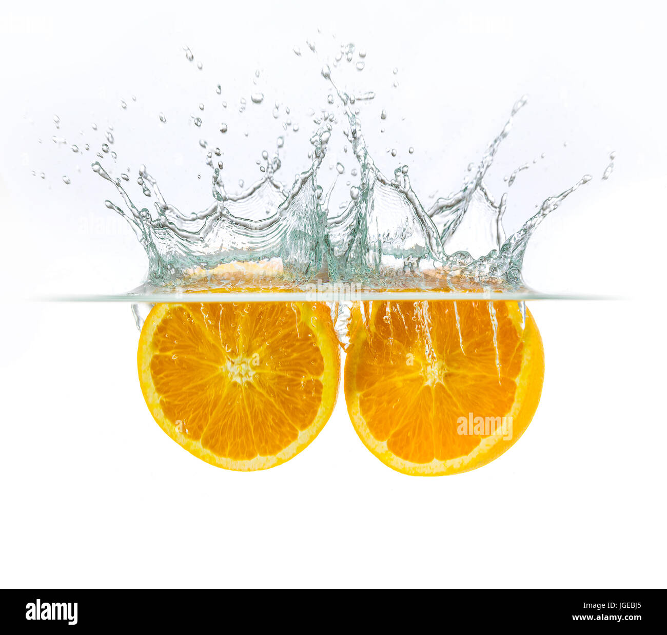 orange drop with water splash Stock Photo - Alamy