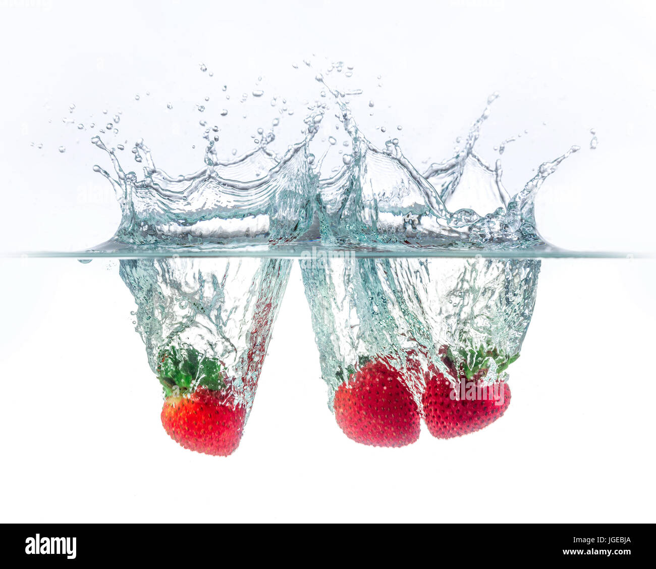 fresh strawberry with water splash on white background Stock Photo - Alamy