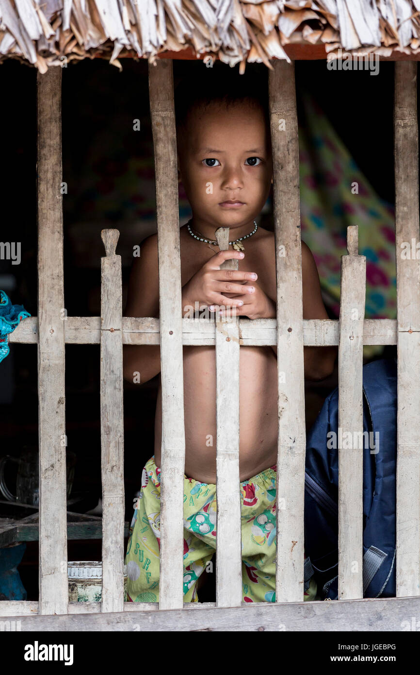 Boy in the window Stock Photo - Alamy