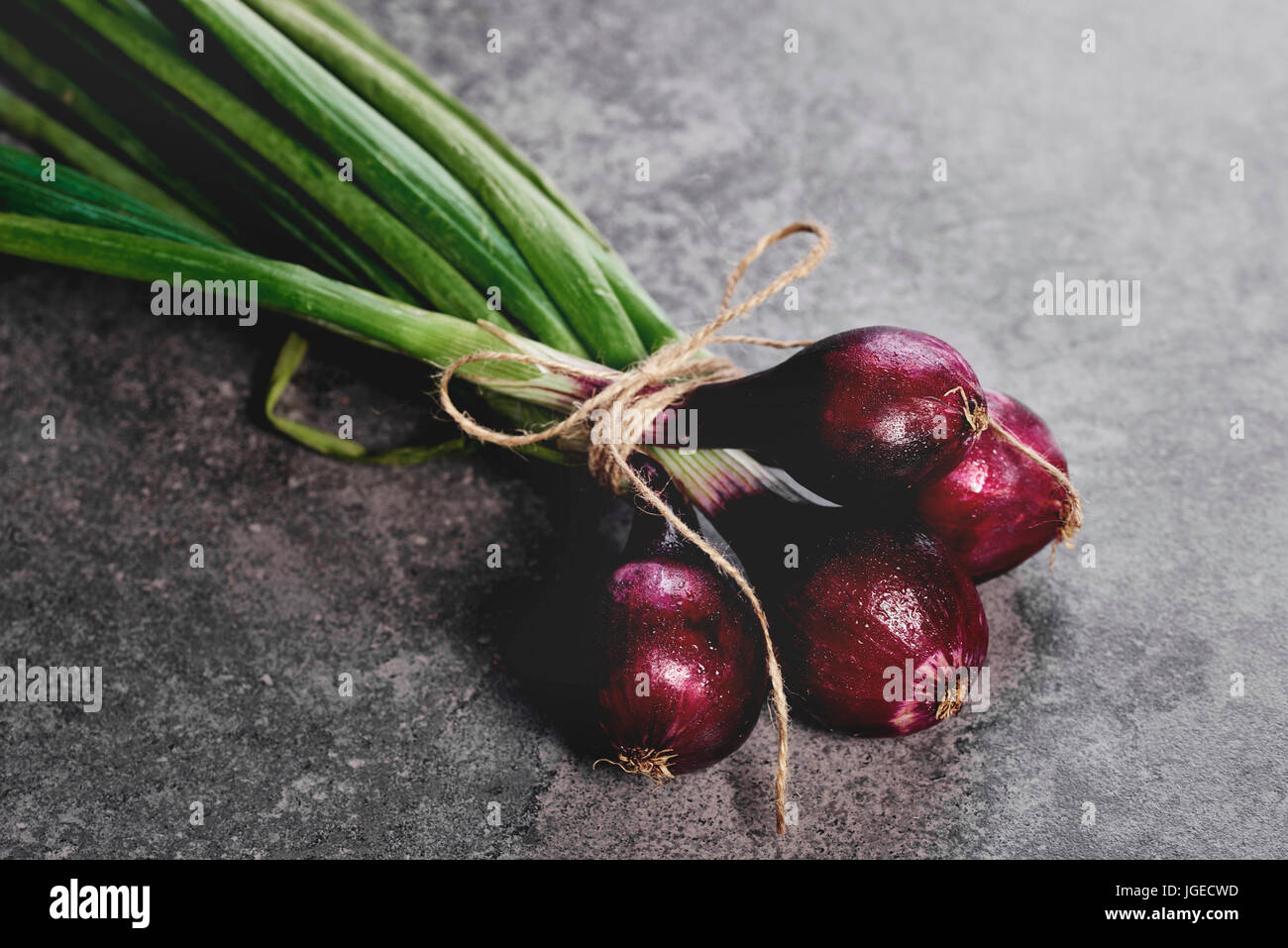 Stack of fresh young onions Stock Photo - Alamy