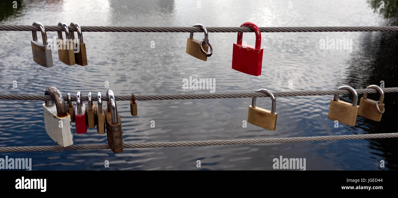 Padlocks on the side of a bridge, safety wires Stock Photo - Alamy