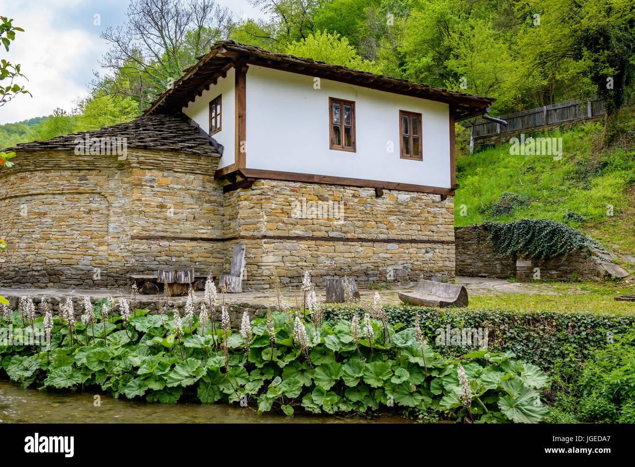 Old traditional Bulgarian house with stone basis and near river and ...