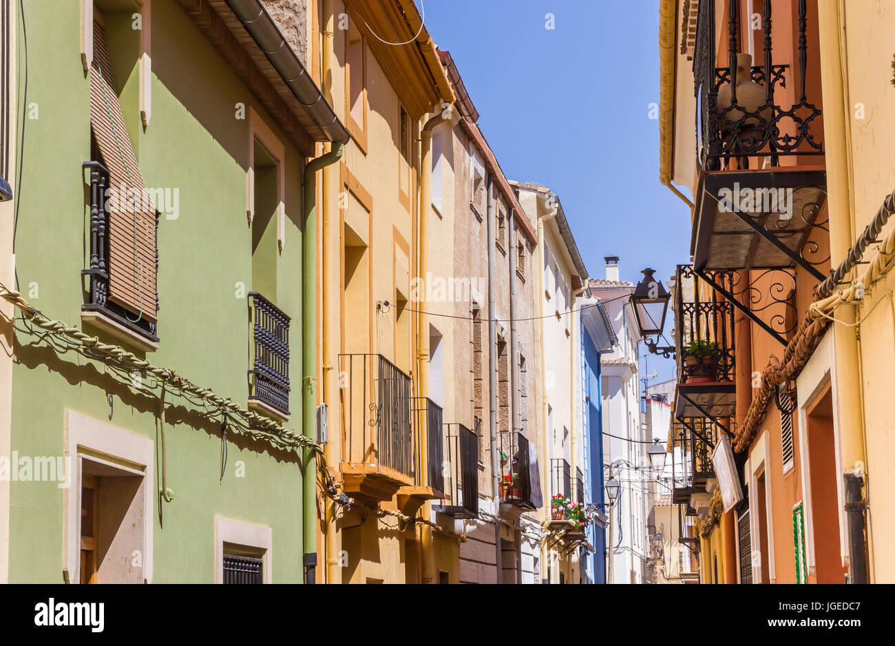 Colorful houses in a narrow street in Ayora, Spain Stock Photo - Alamy