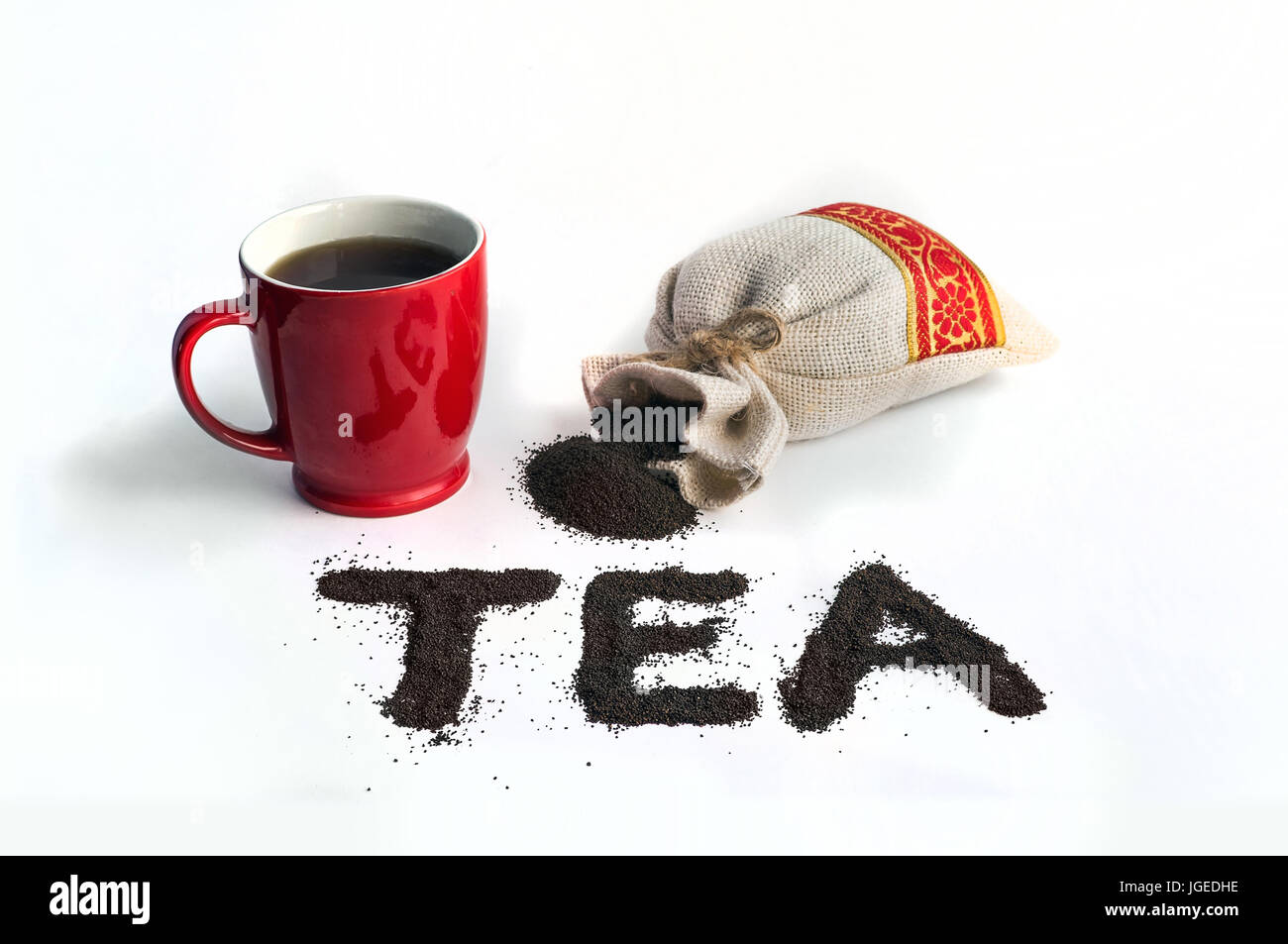 The word tea is laid out small leaf black tea. Red mug of tea a packet ...