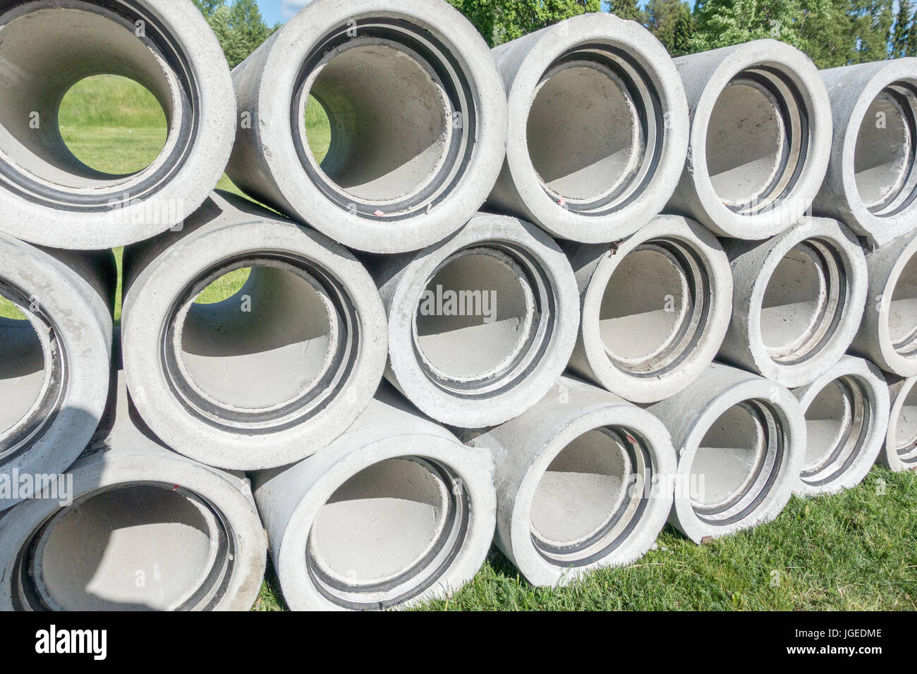 concrete drainage pipes in a pile Stock Photo - Alamy