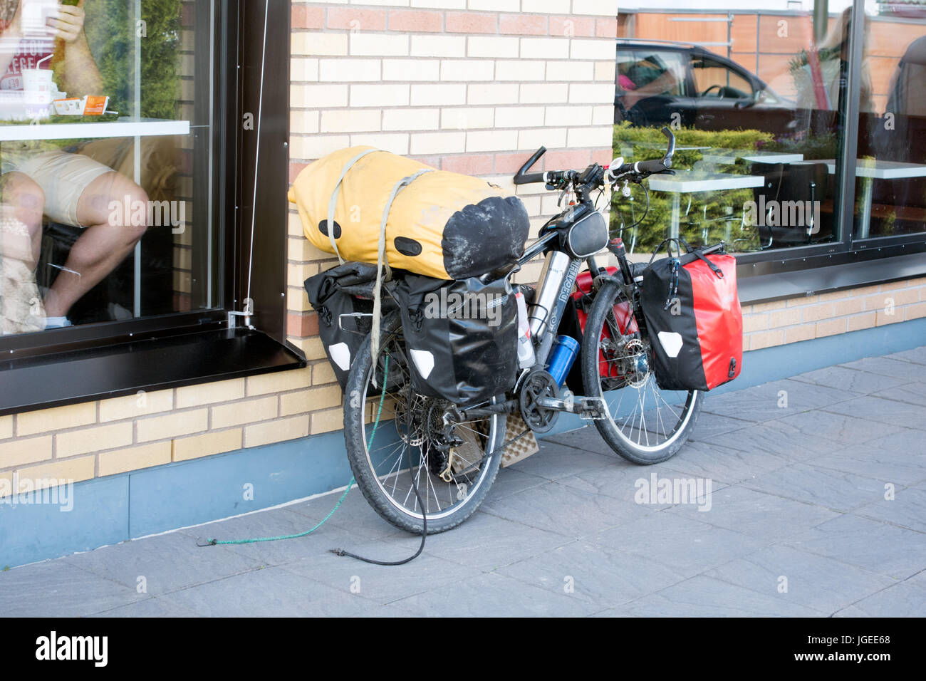 Long tour bike with loads of packing Stock Photo - Alamy