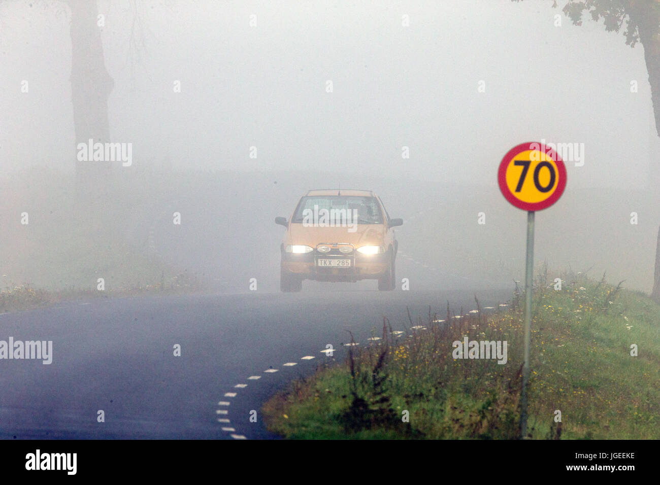 Car on a foggy highway Stock Photo - Alamy