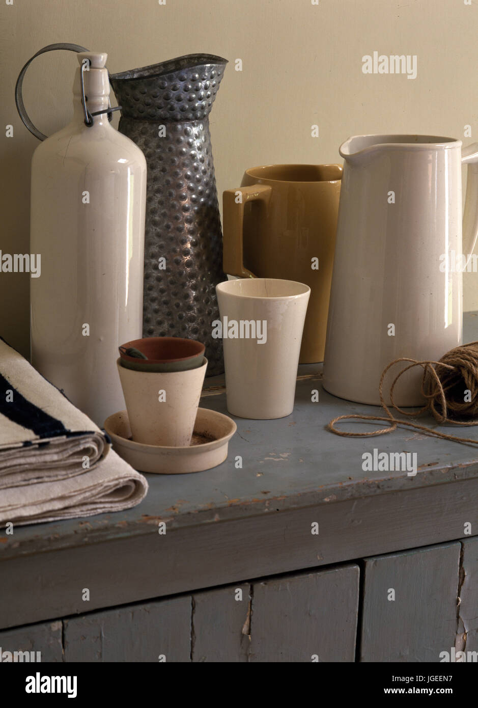 Collection of jugs on top of cupboard Stock Photo - Alamy