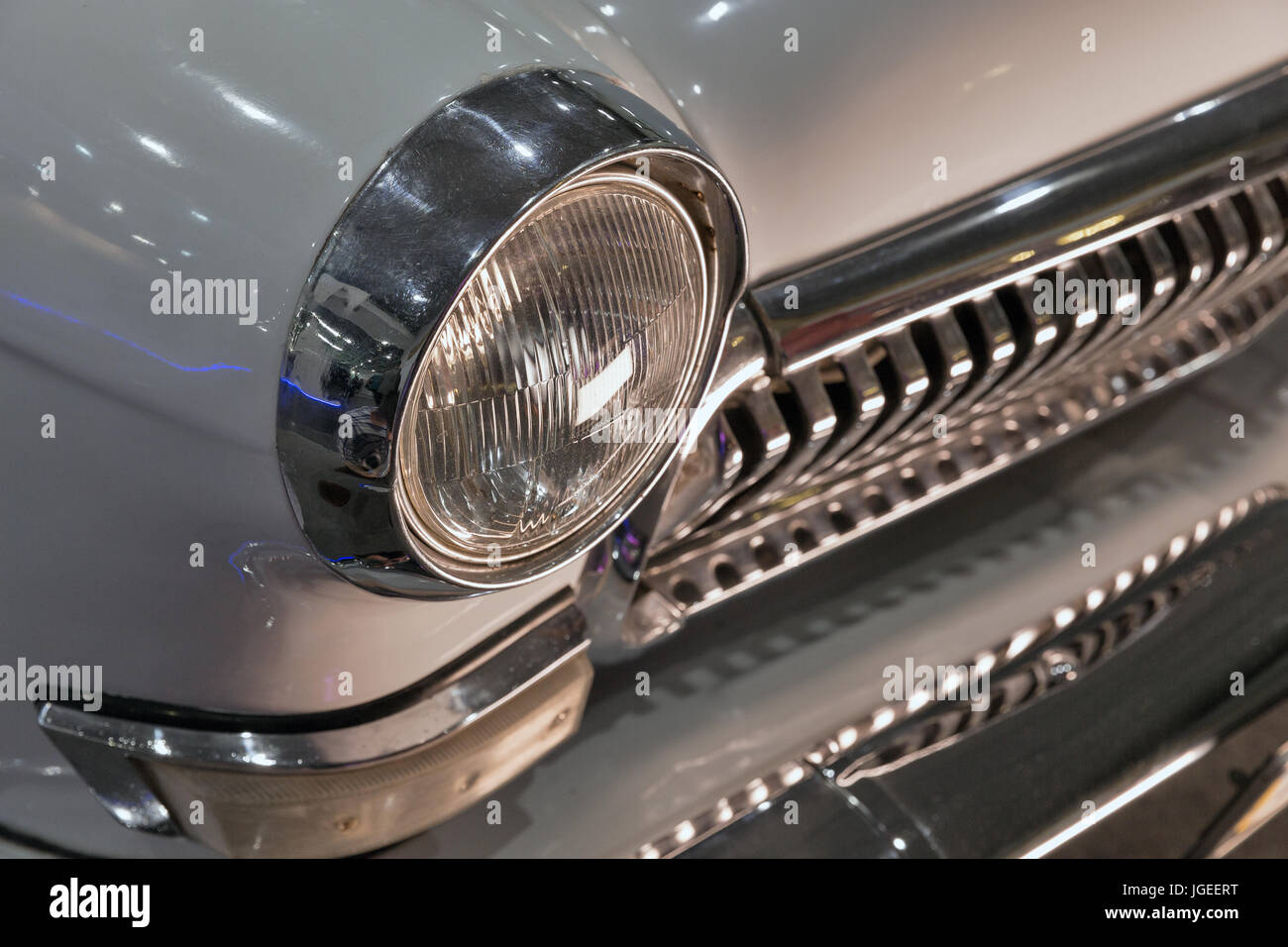 Retro headlight of white vintage car closeup Stock Photo - Alamy