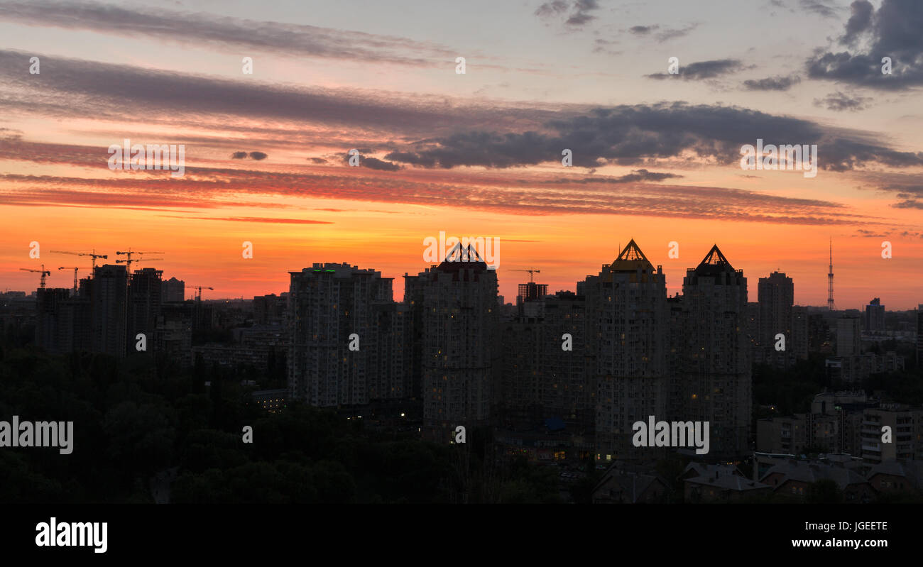 Urban dramatic sunset over skyscrapers Stock Photo - Alamy