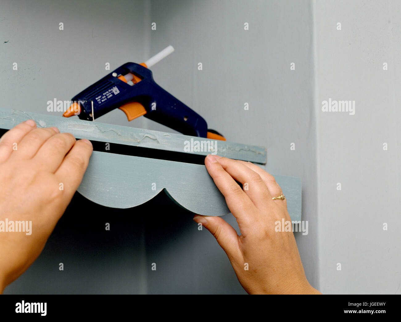 Step x step: Fitting a corner shelf Stock Photo - Alamy