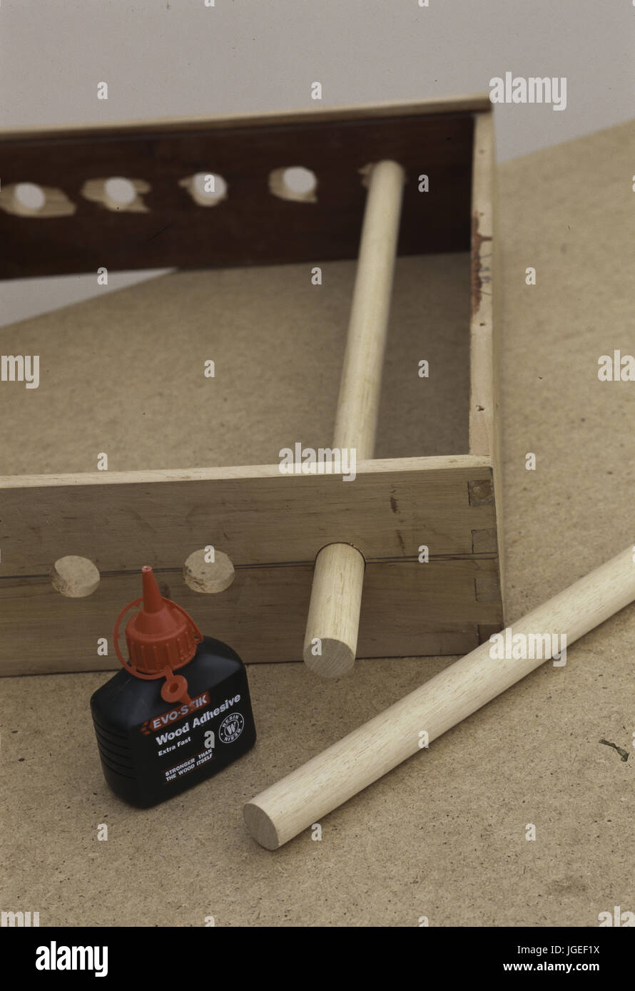 Wooden frame with dowels. Making a suspended wooden storage rack. Step ...