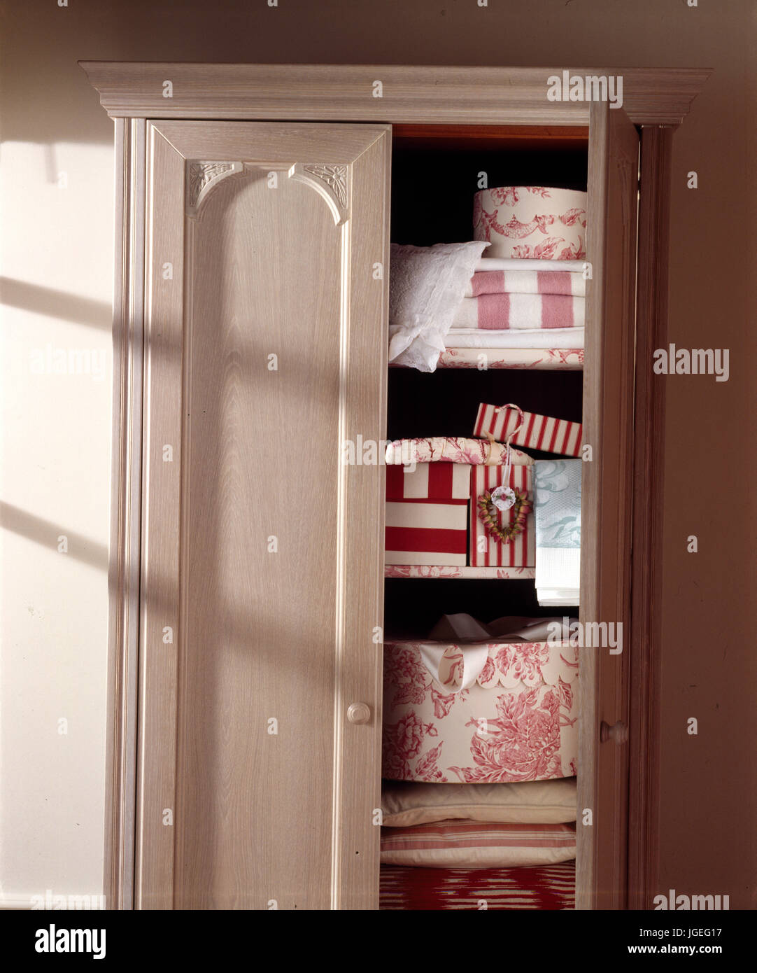 Tradition linen storage cupboard with open door showing contents Stock ...