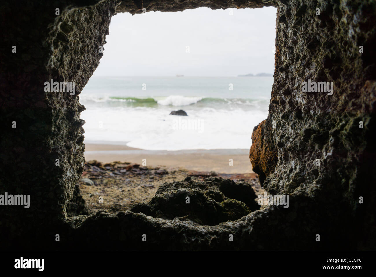 Broken wall revealing ocean beyond Stock Photo - Alamy