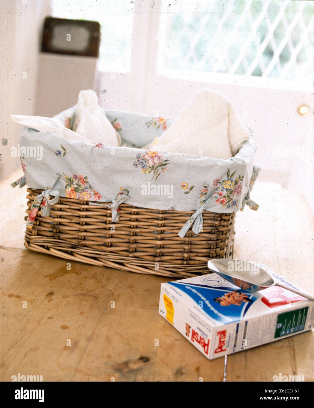 Basket lined with pretty floral fabric Stock Photo - Alamy
