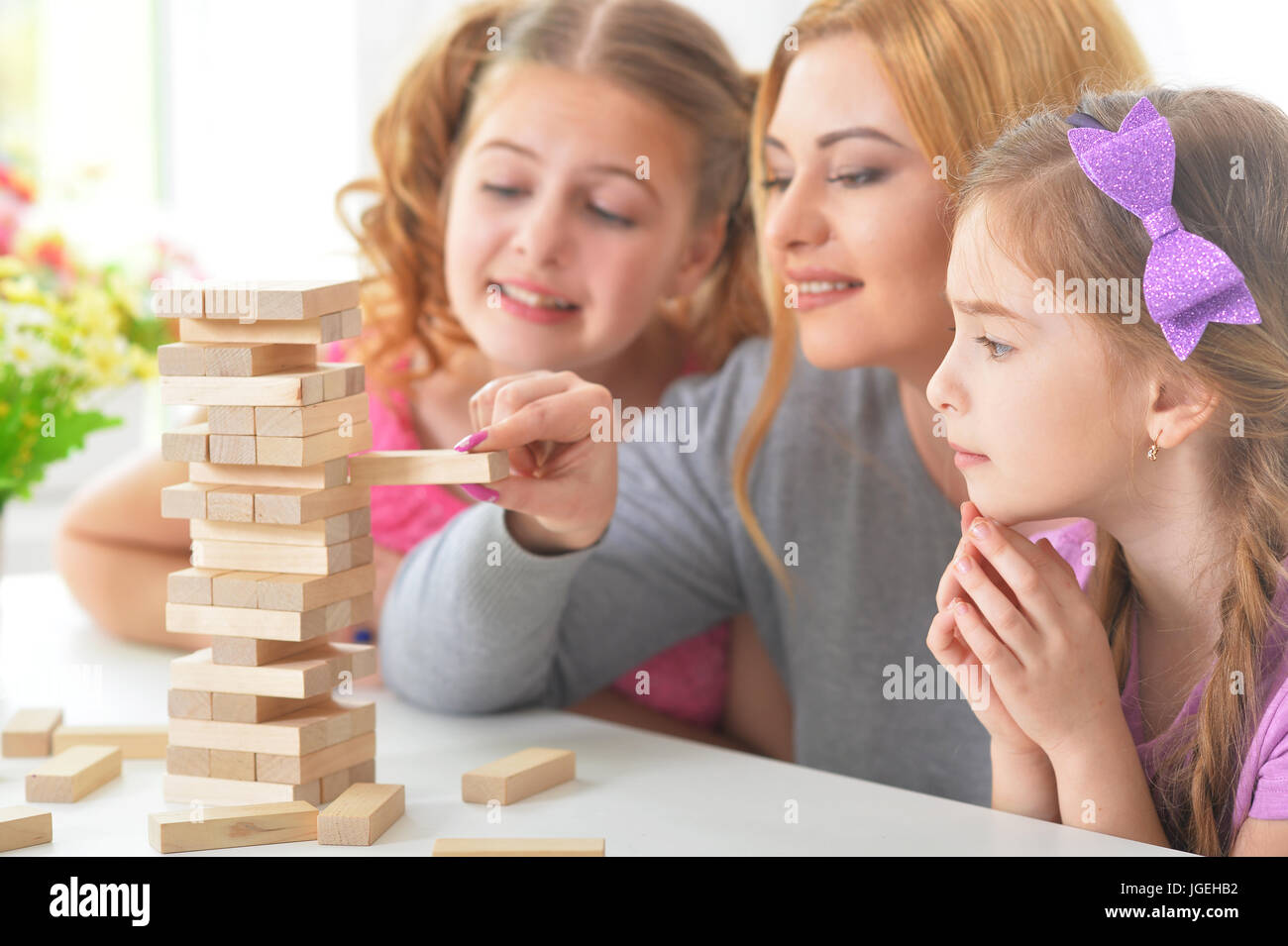 Family playing with blocks together Stock Photo - Alamy