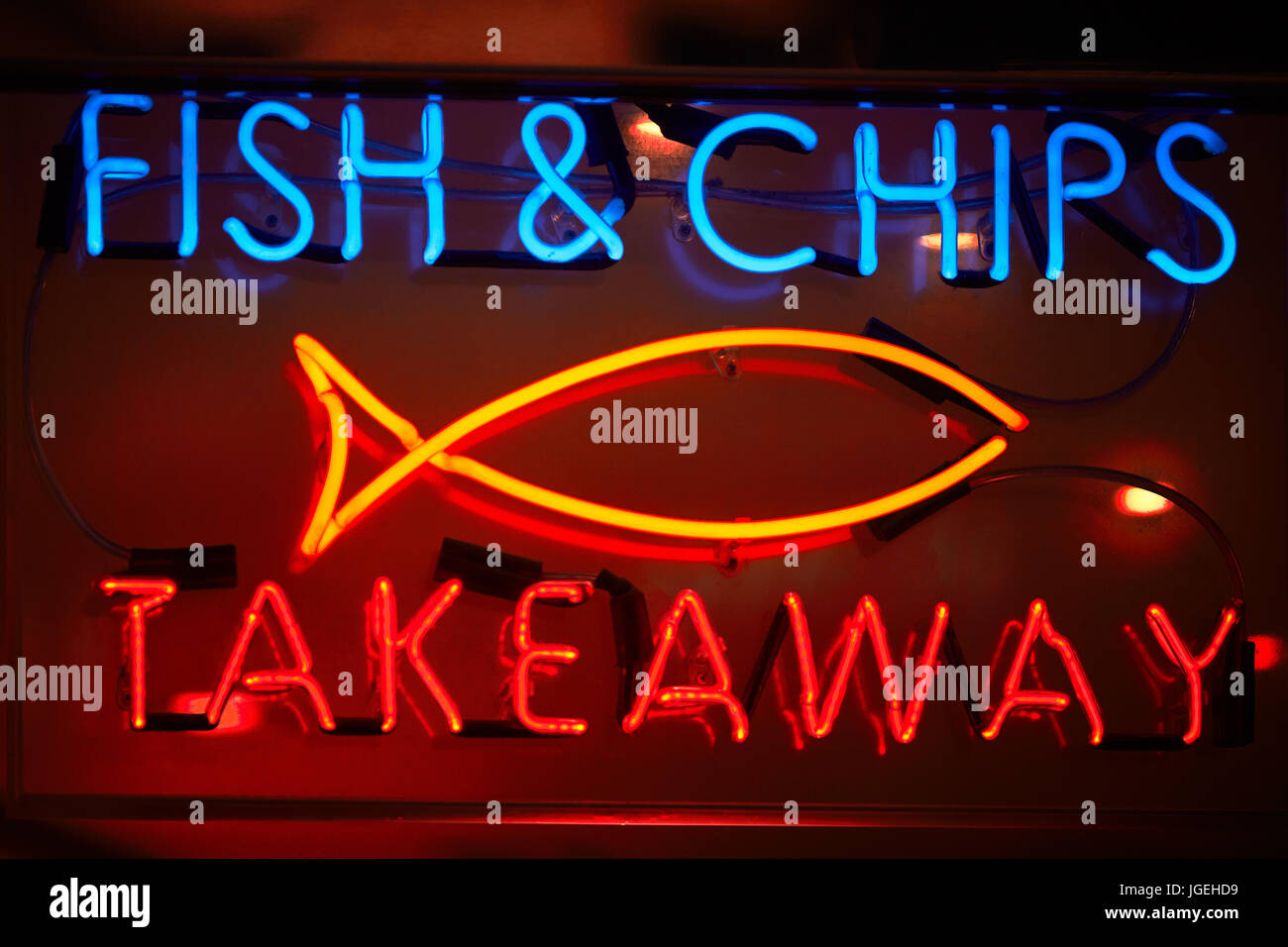 Neon sign for fish & chips takeaway Stock Photo - Alamy