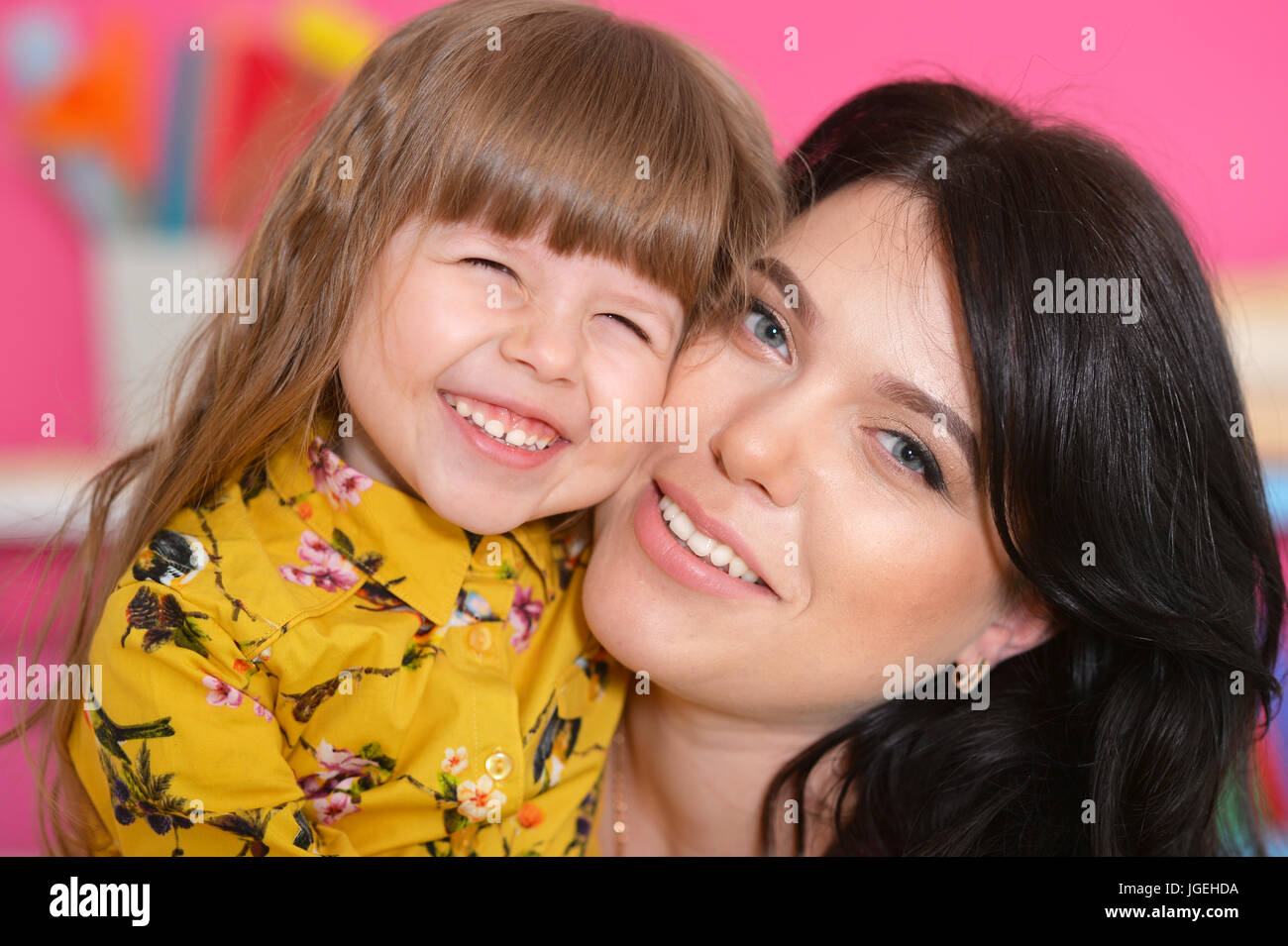 Mother and daughter posing Stock Photo - Alamy
