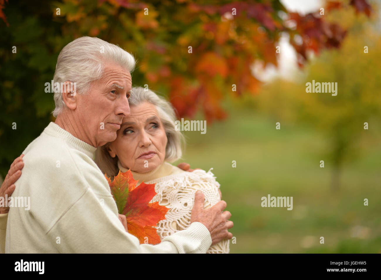 sad senior couple hugging Stock Photo - Alamy