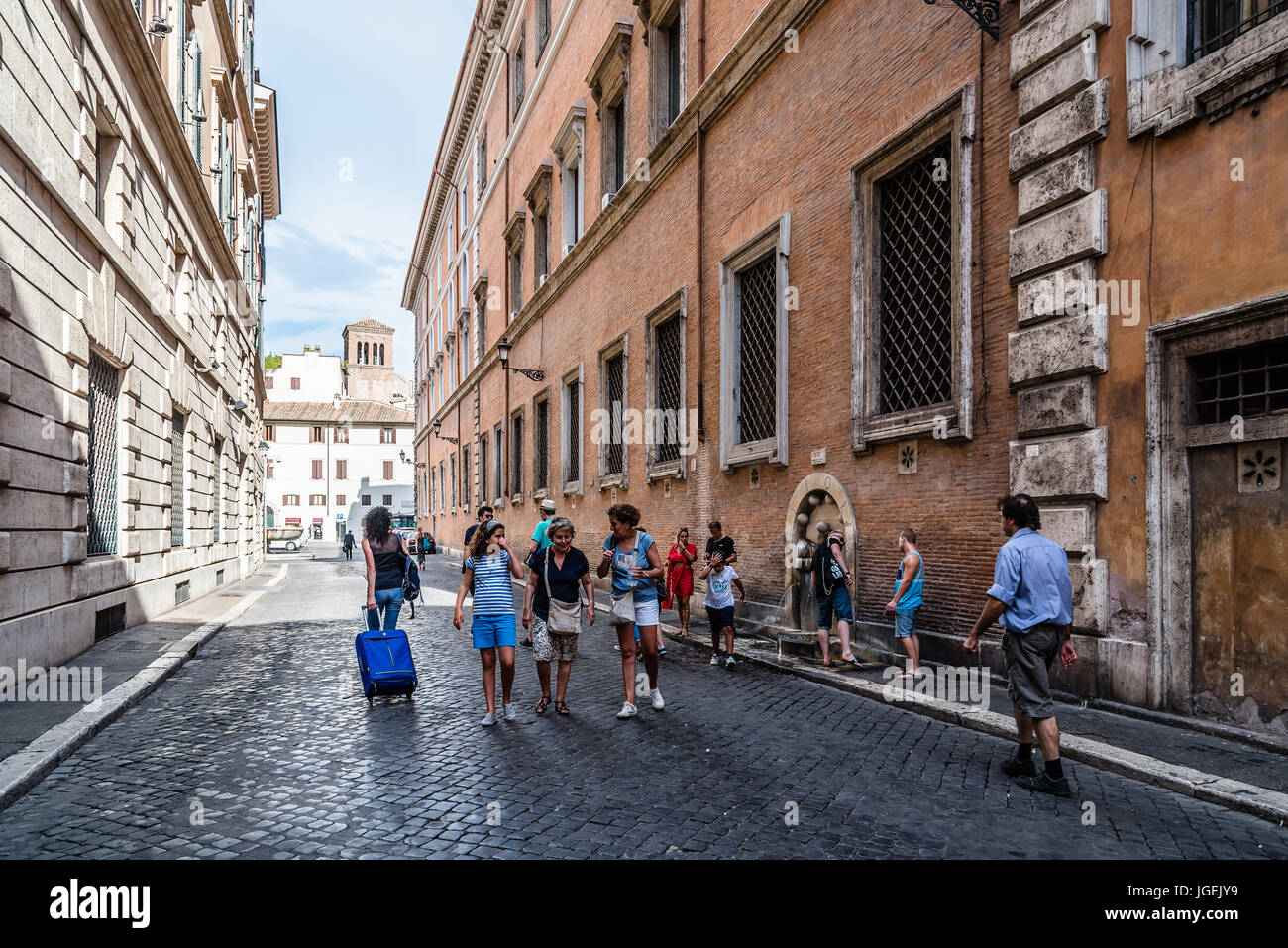 Rome, Italy - August 18, 2016: Tourists in traditional street in the ...