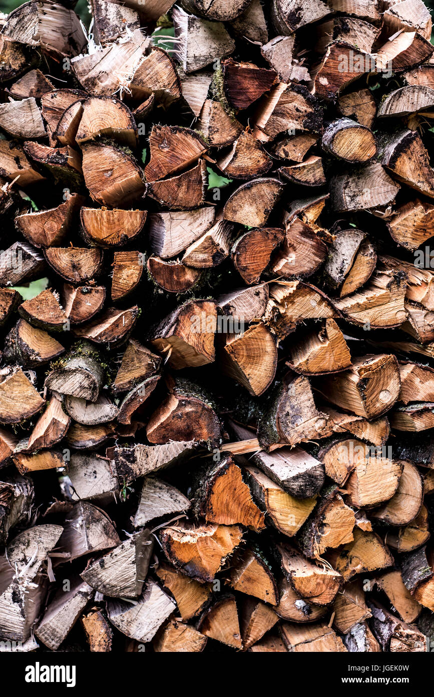 Abstract photo of a pile of natural wooden logs background dry chopped ...