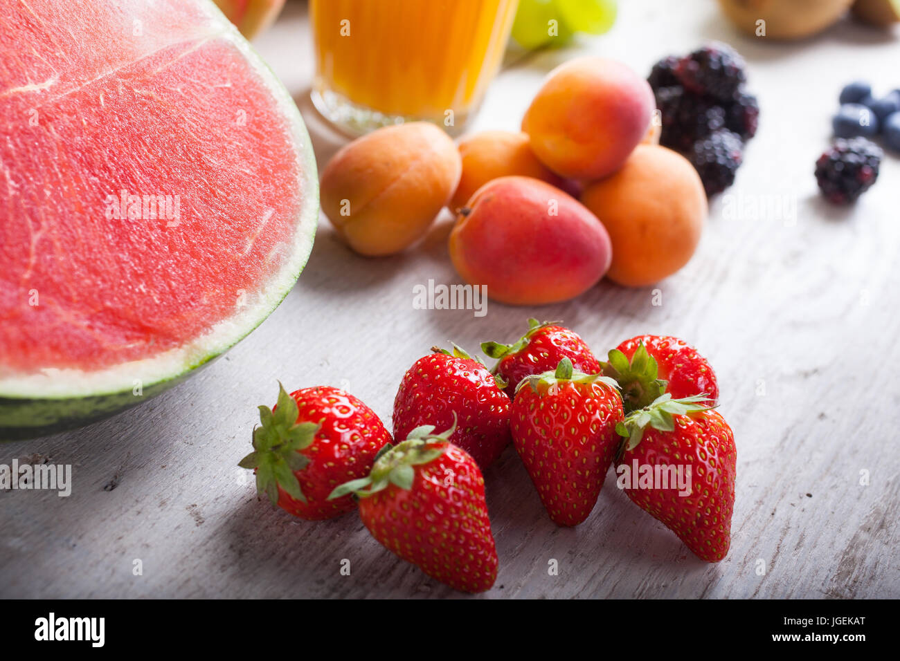 Watermelon, strawberries and apricots Stock Photo - Alamy