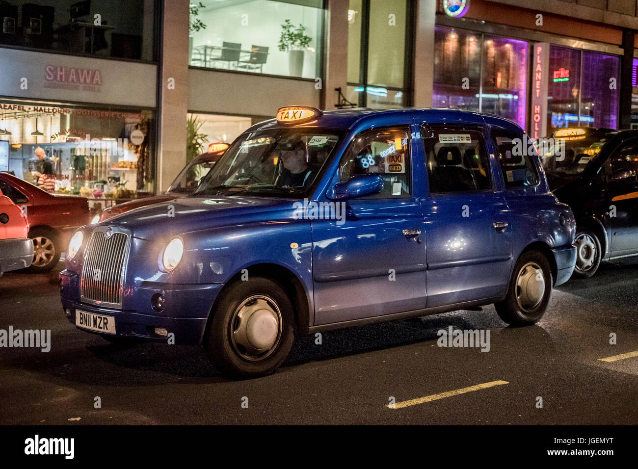 Blue taxi in London, United Kingdom Stock Photo - Alamy