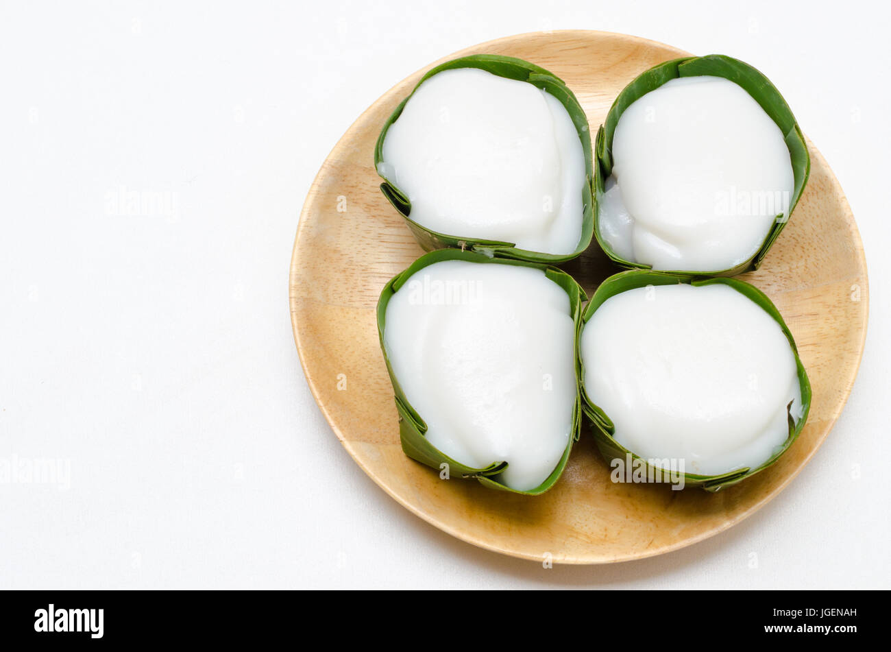 Thai popular dessert, Taro-pudding with coconut-milk topping on wood ...