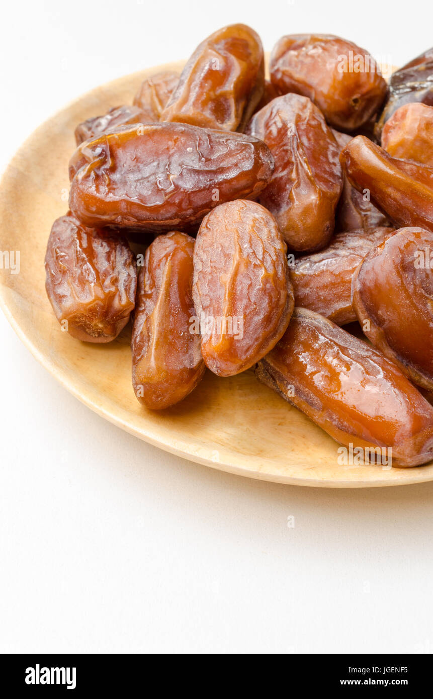 Date Palm on wood plate Stock Photo - Alamy