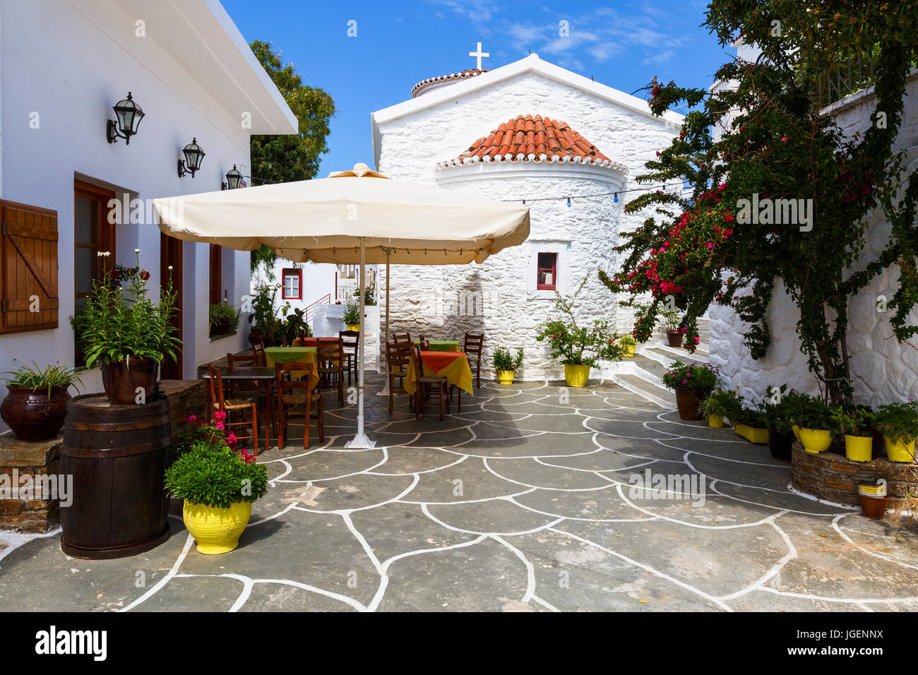 Coffee shop in a street of Messaria village on Kythnos island Stock ...