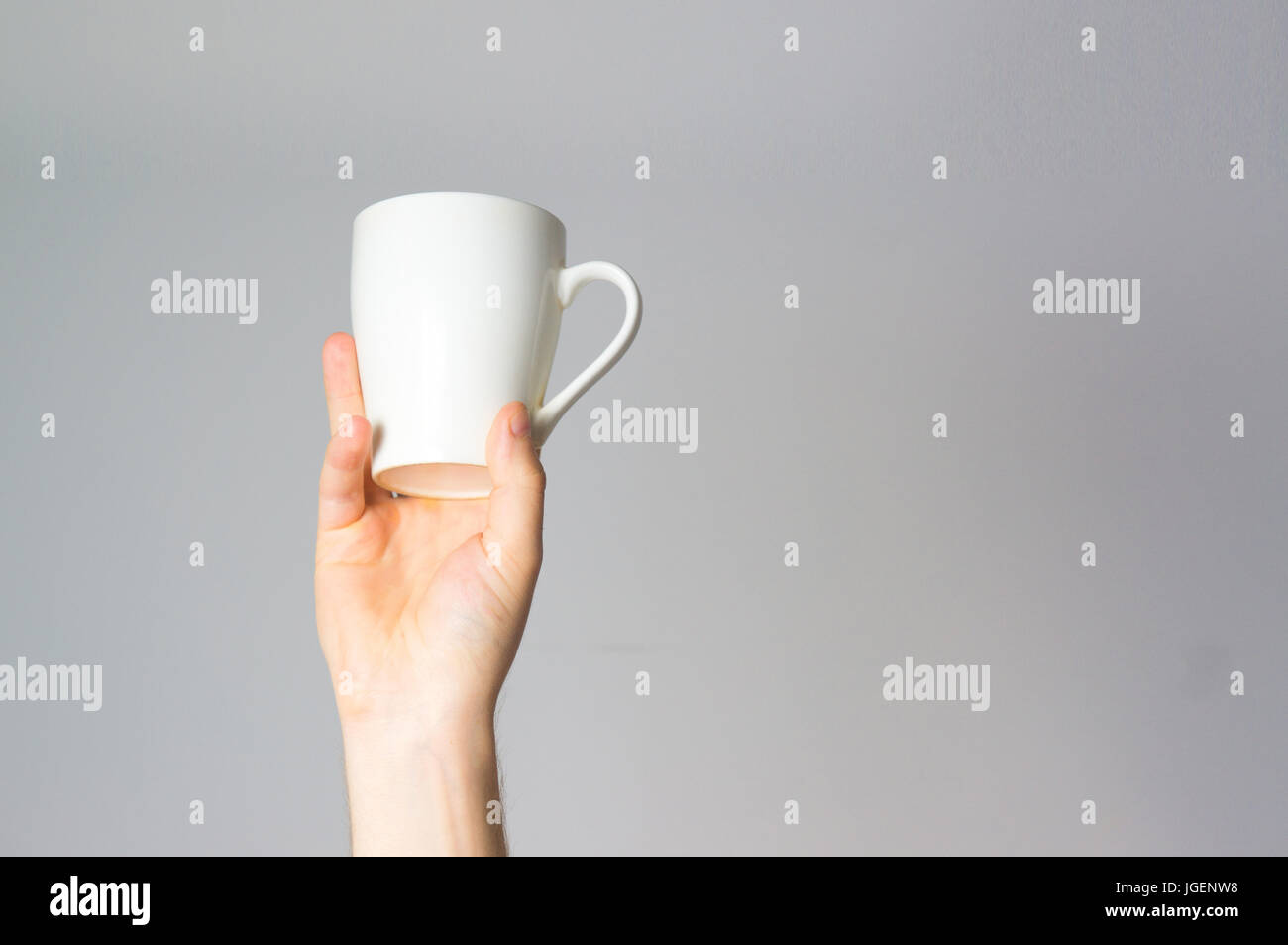 Mug in hand hi-res stock photography and images - Alamy