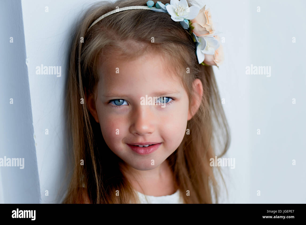 Charming girl with long ash-blond hair , lively blue eyes and a pinched ...