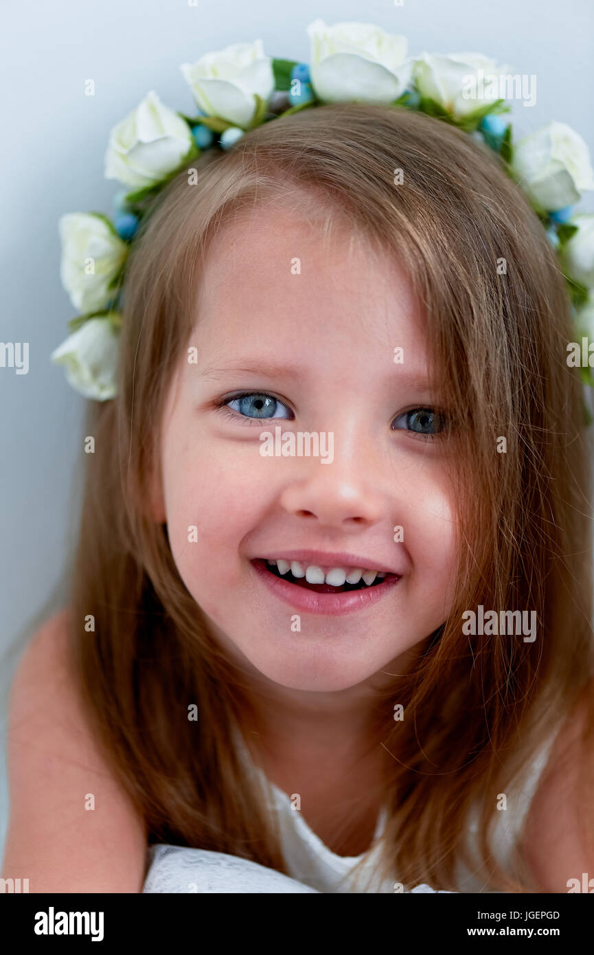 Charming girl with long ash-blond hair , lively blue eyes and a pinched ...