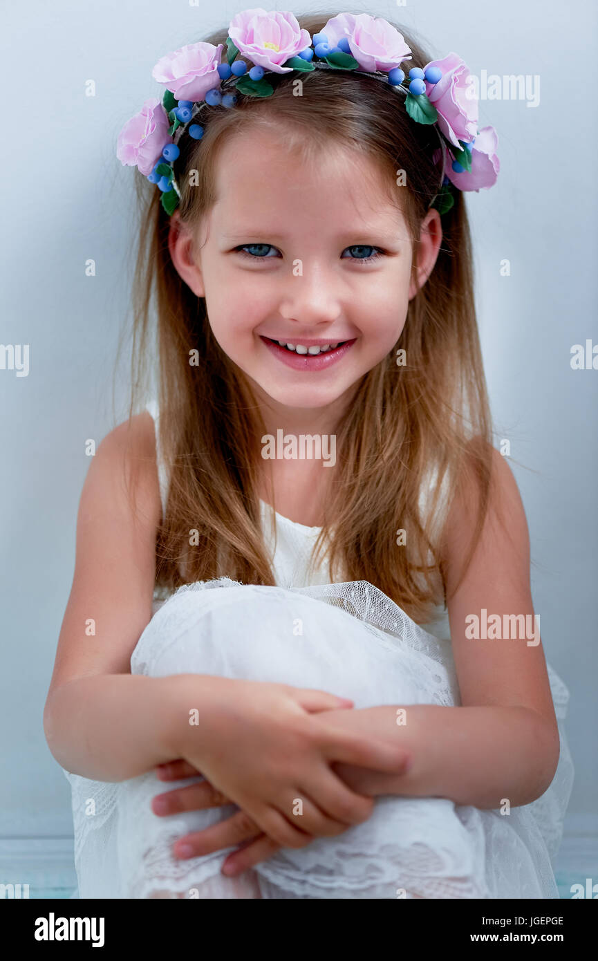 Charming girl with long ash-blond hair , lively blue eyes and a pinched ...