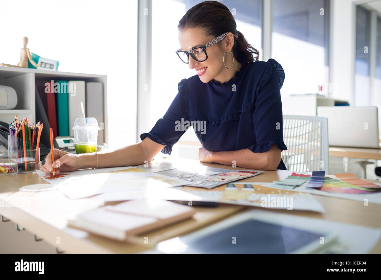 Female executive working at her desk in office Stock Photo - Alamy