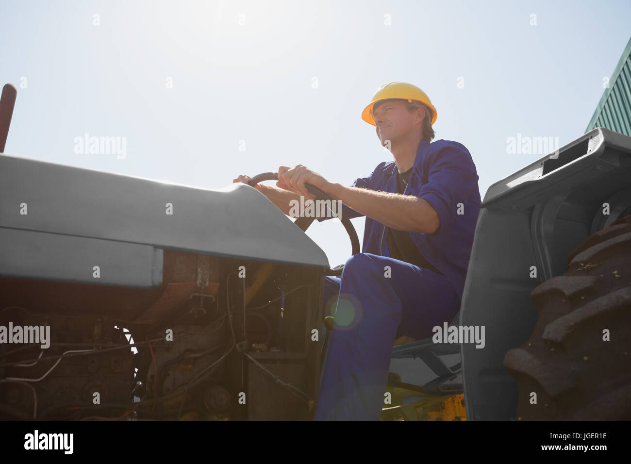 Worker with tractor hi-res stock photography and images - Alamy