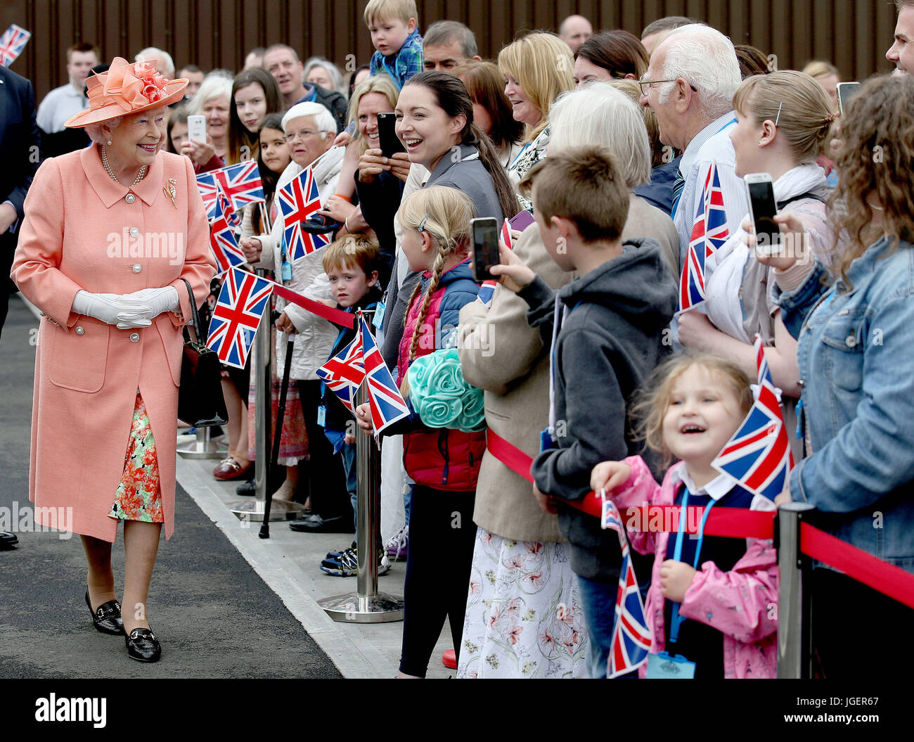 Queen Elizabeth II meets the waiting crowd as she visits the new ...