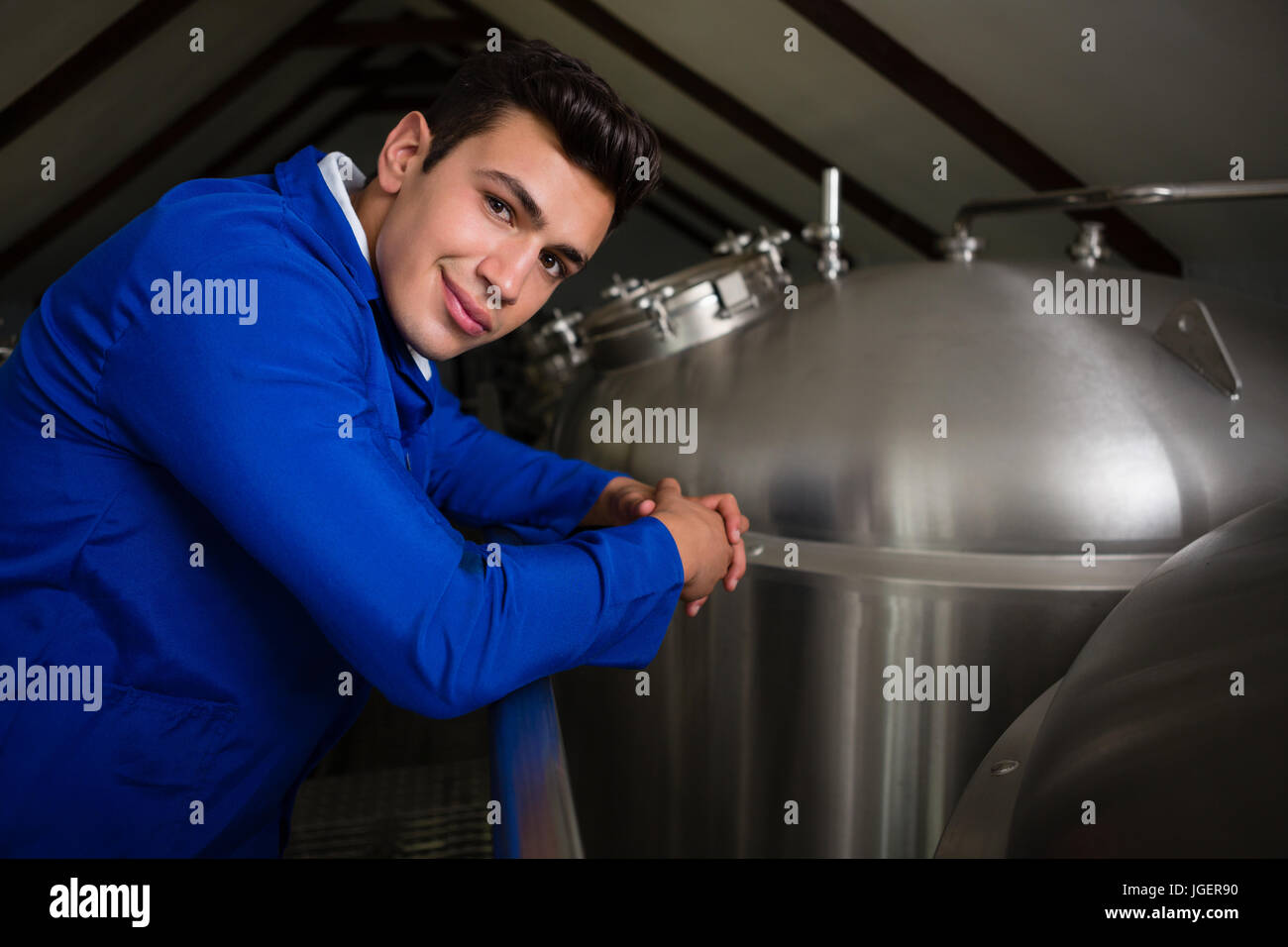 Worker standing ladder tank hi-res stock photography and images - Alamy