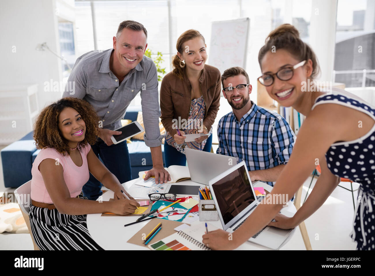 Portrait of team of executives working together in the office Stock ...