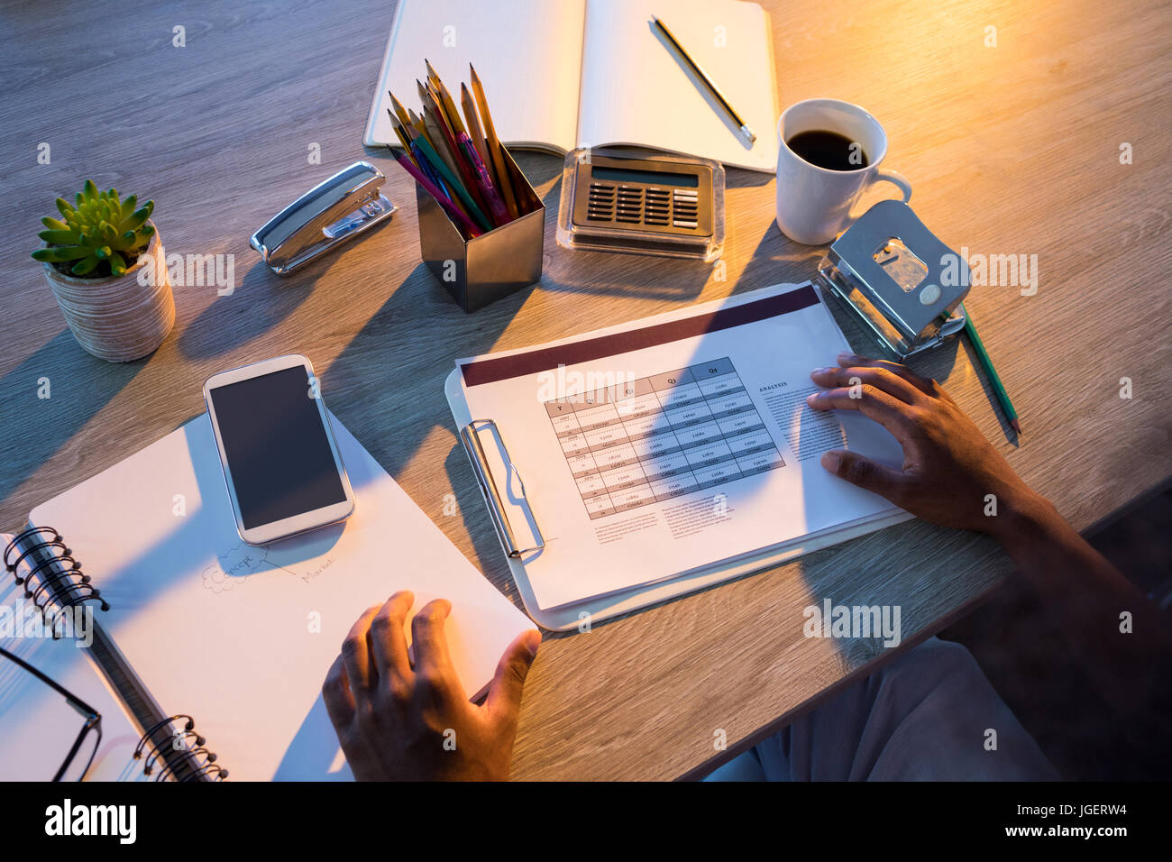 Male executive working at his desk in office Stock Photo - Alamy