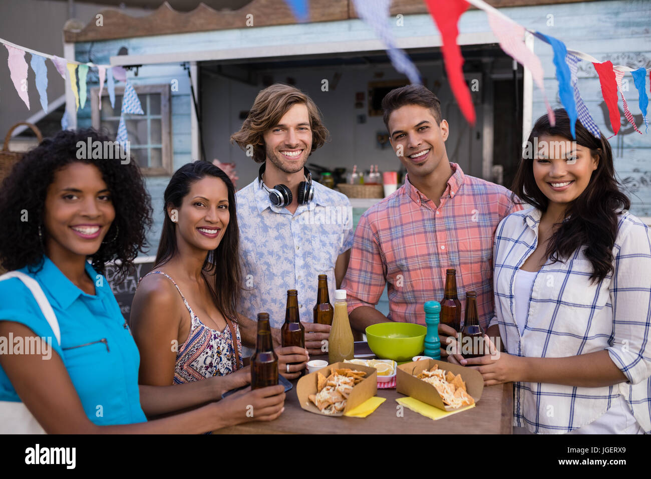Portrait of happy friends having meal in cafeteria Stock Photo - Alamy