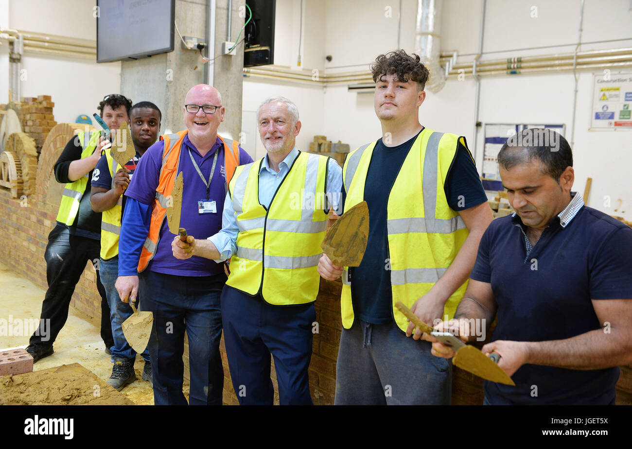 Labour leader Jeremy Corbyn with students after he tried his hand at ...