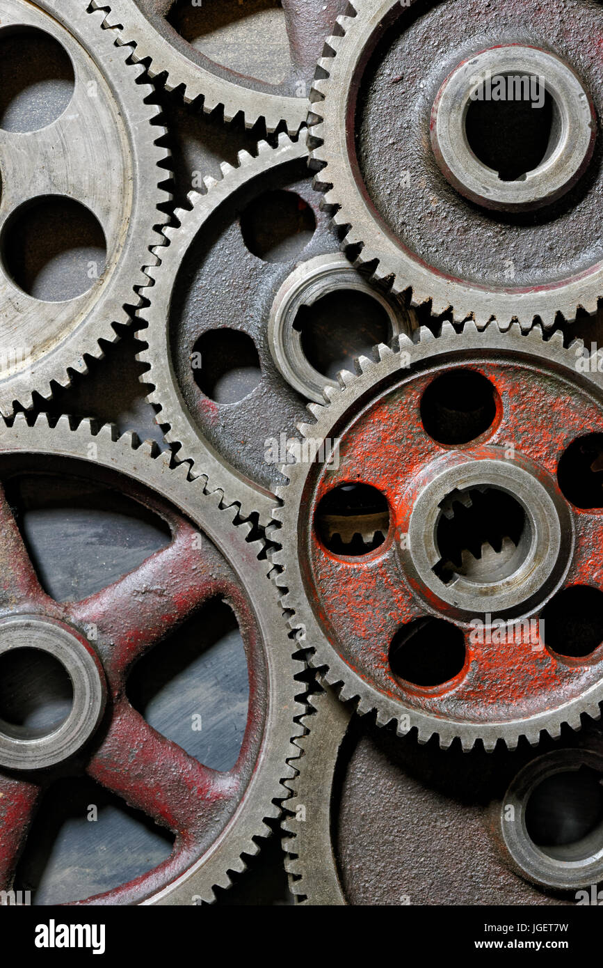Backgrounds and textures: set of connected steel cogwheels, big, heavy ...