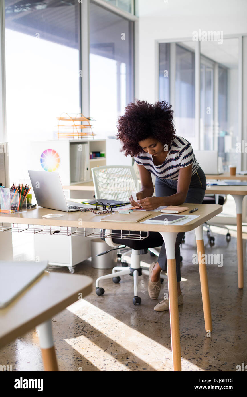 Female executive working at her desk in office Stock Photo - Alamy