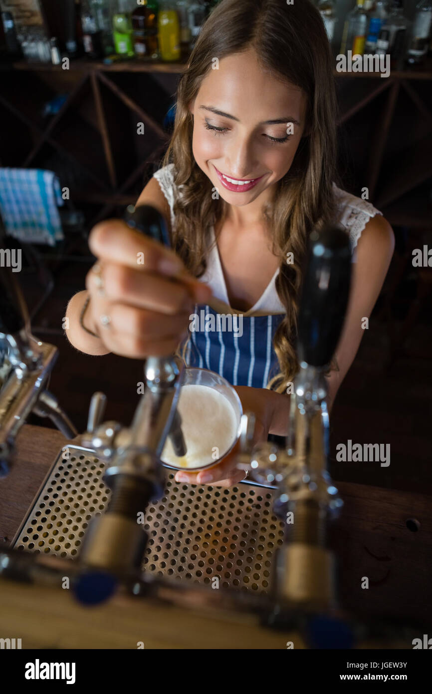 Beautiful barmaid pouring beer in hi-res stock photography and images ...