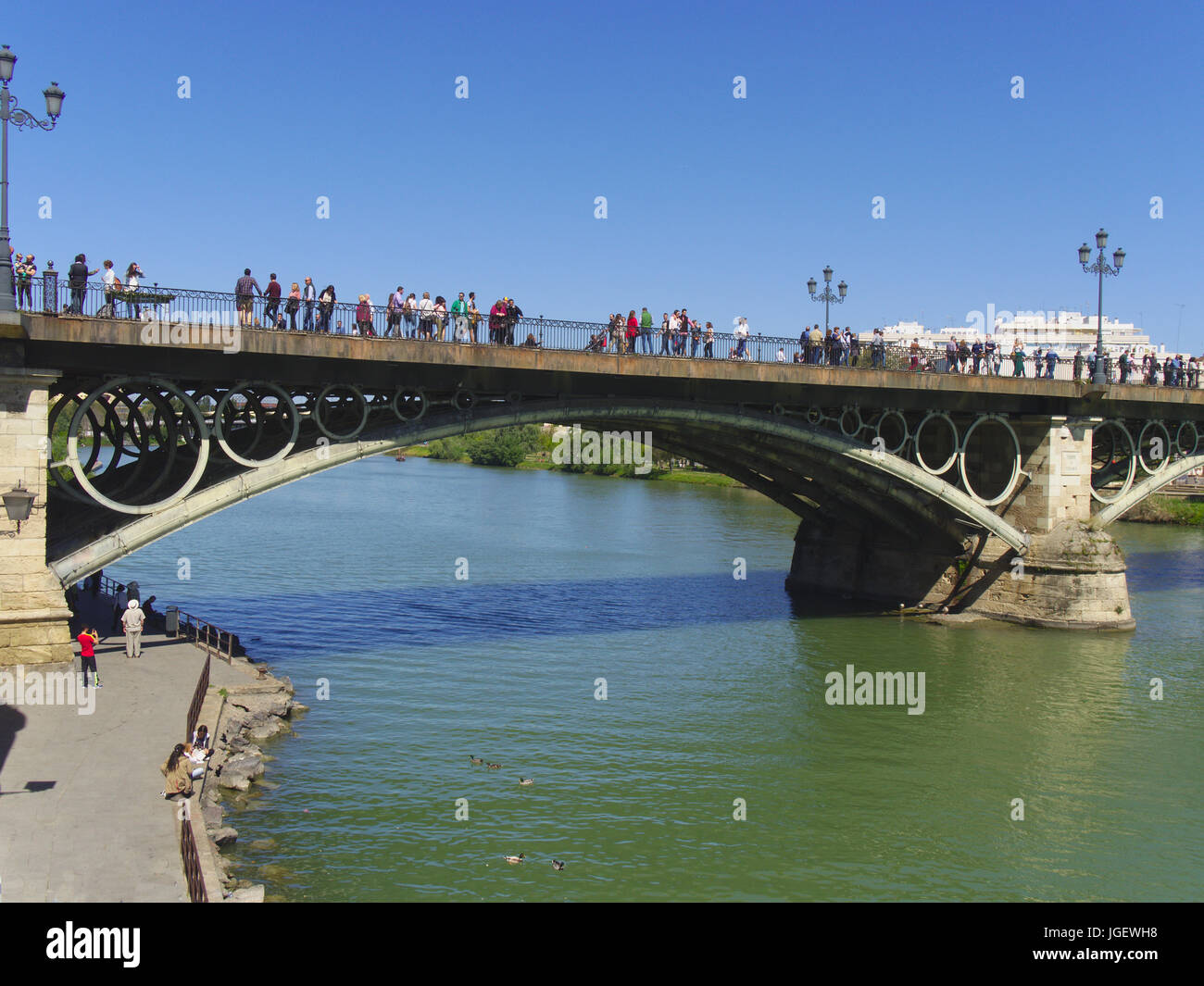 The Isabel II Bridge (aka Triana Bridge) with crowd Stock Photo - Alamy