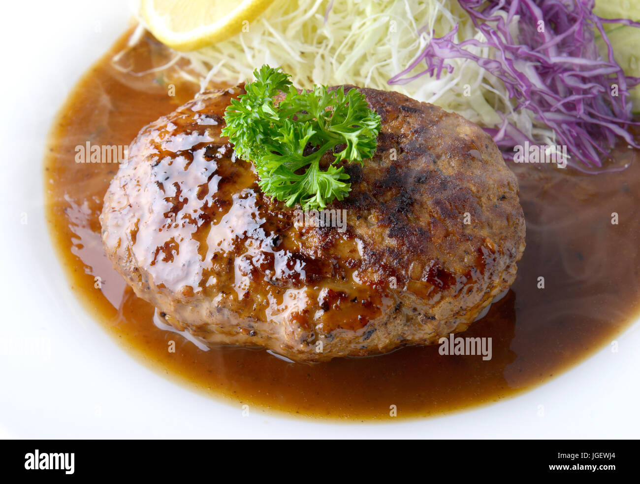 Japanese style hamberger or hamberg serve with gravy sauce and ...