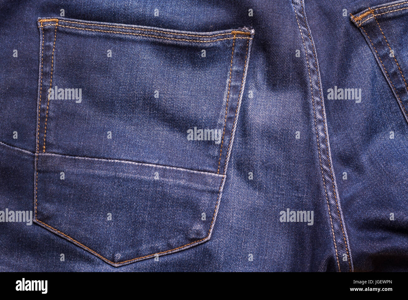 One Blue jeans back pocket as a close up Stock Photo - Alamy