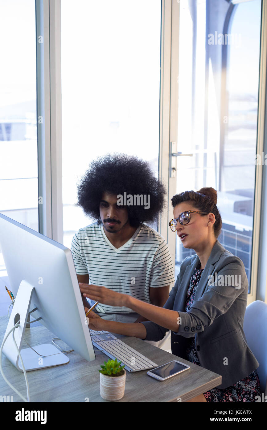 Business executives interacting over mobile hi-res stock photography ...