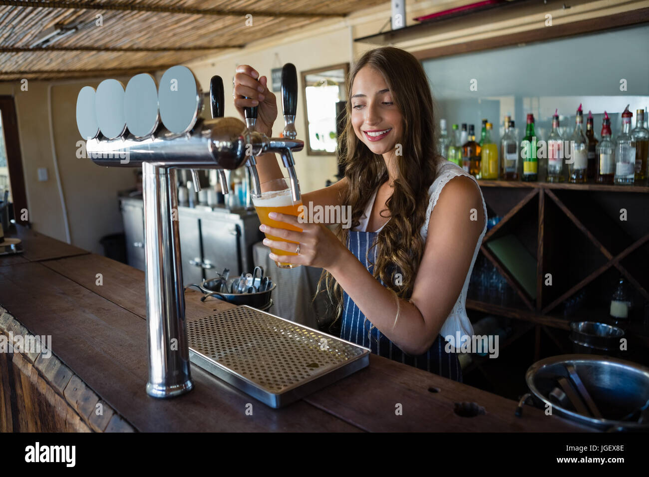 Beautiful barmaid pouring beer in hi-res stock photography and images ...